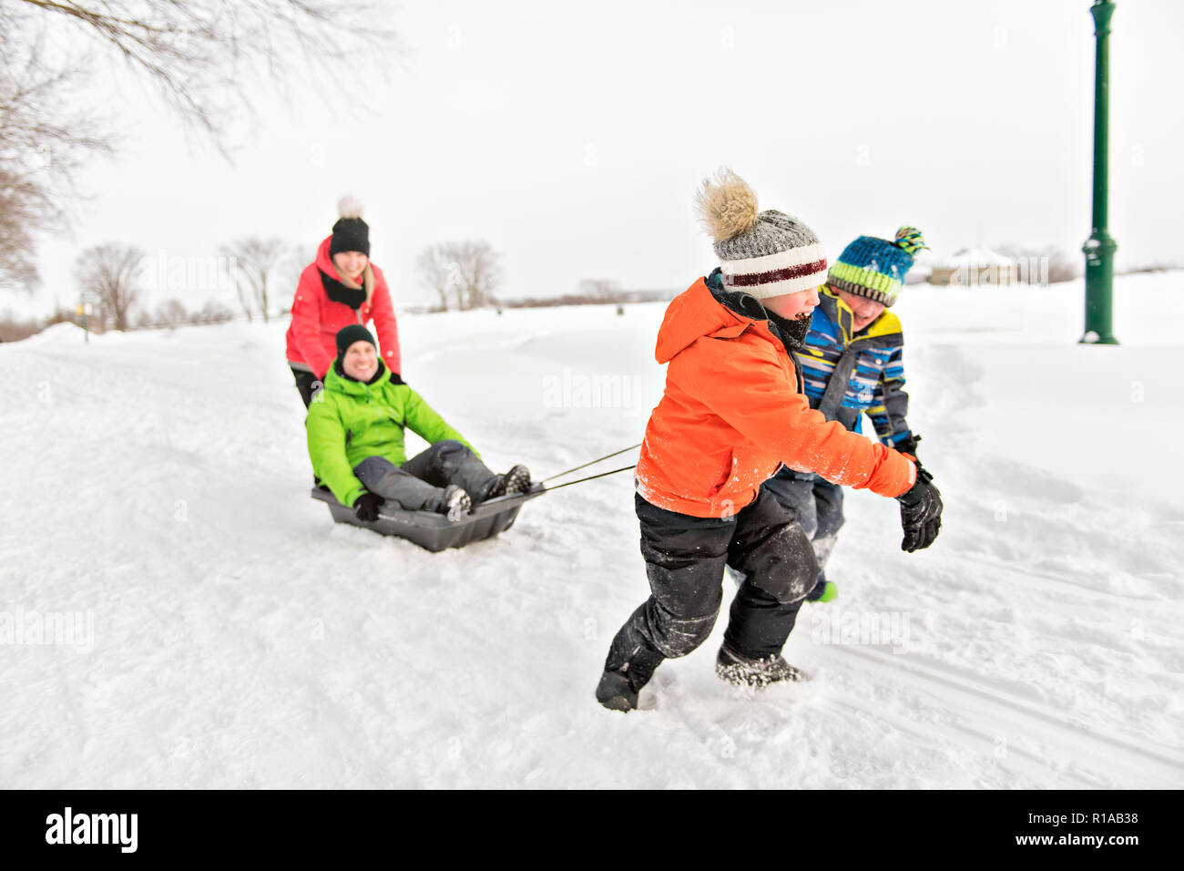 Boy pulling sledge hi-res stock photography and images - Alamy