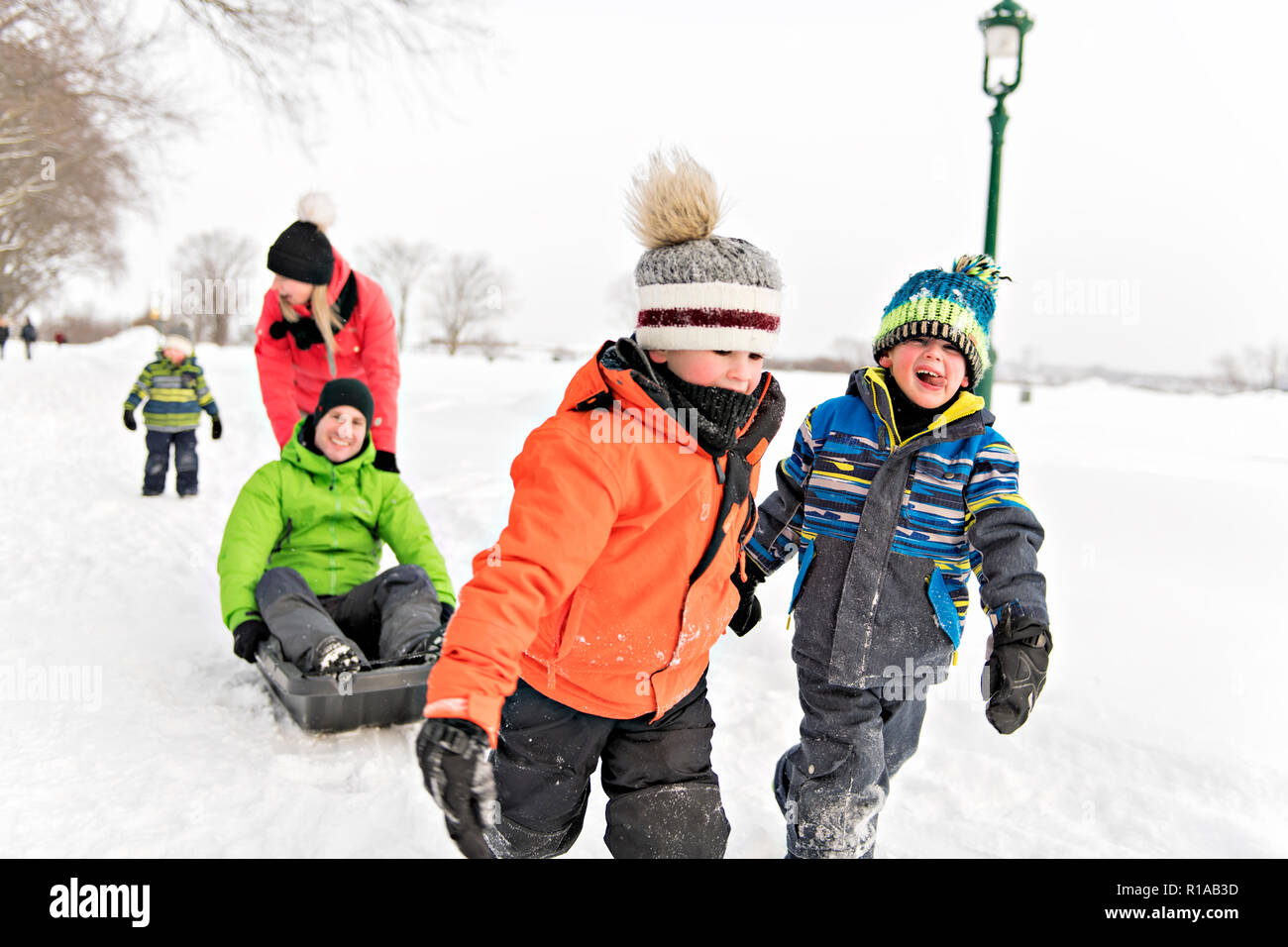 Boy pulling sledge hi-res stock photography and images - Alamy