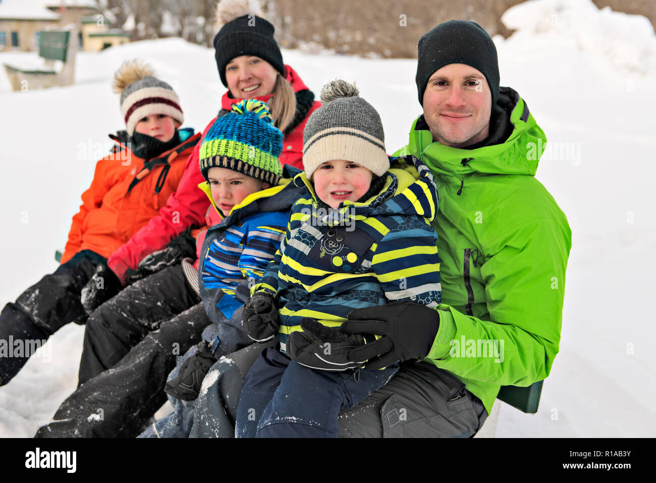 family and child spending time outdoor in winter Stock Photo - Alamy