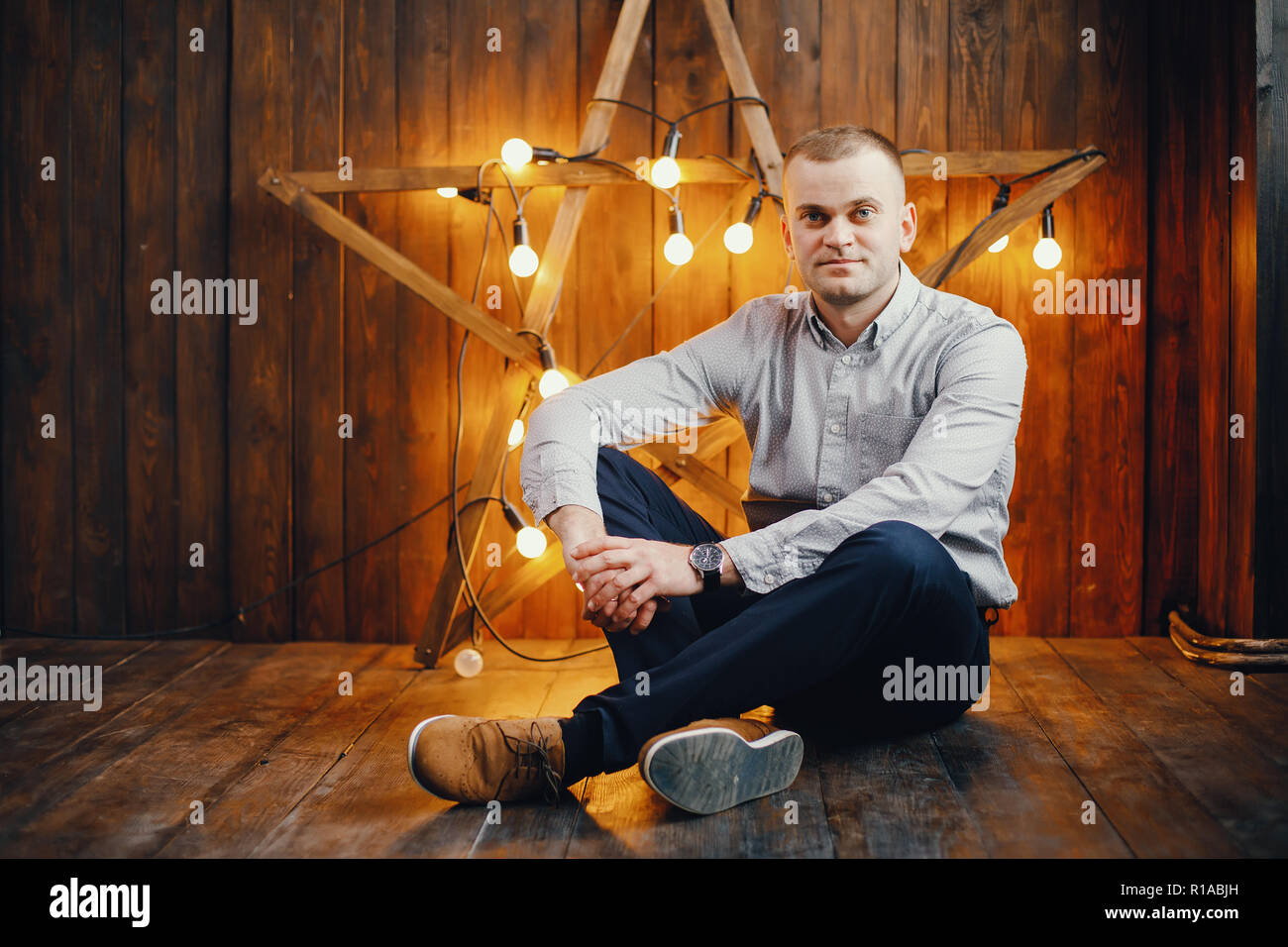 man sitting on the floor Stock Photo - Alamy