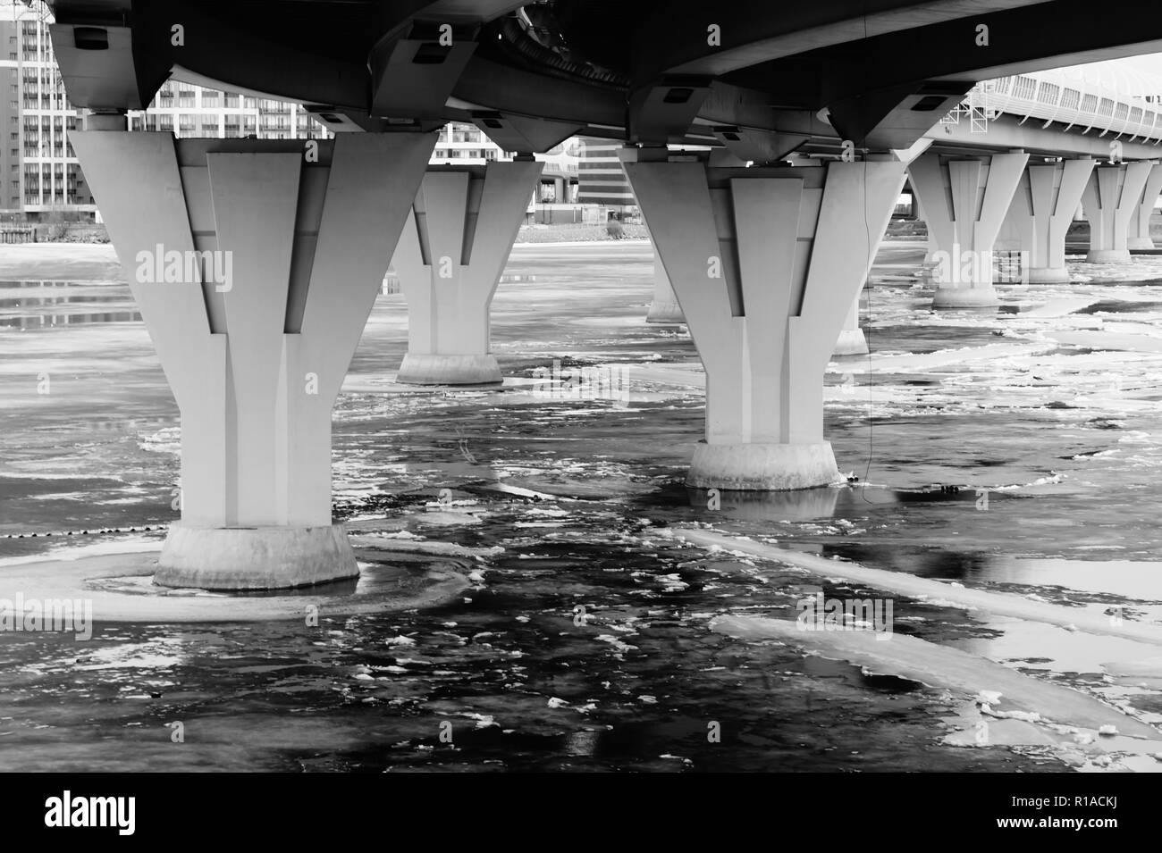 Bridge pillars in the cold water black and white background Stock Photo ...