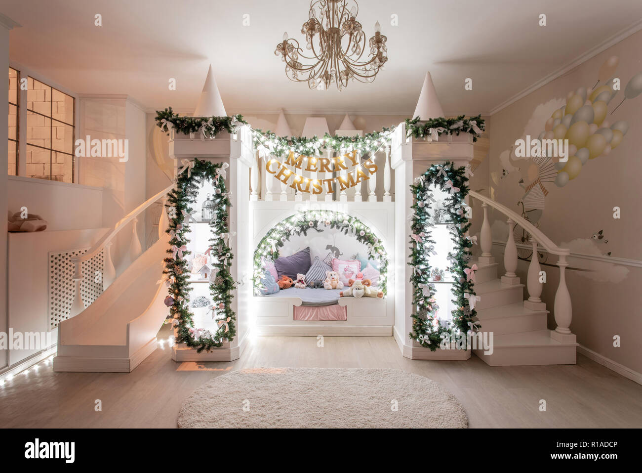 Christmas evening. Interior of a spacious children's room. decorative ...