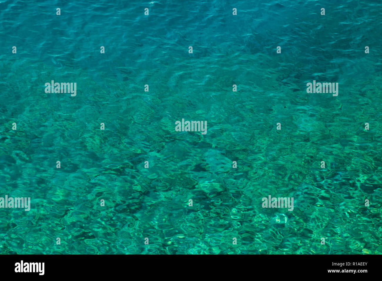 Clear turquoise water texture background Stock Photo - Alamy