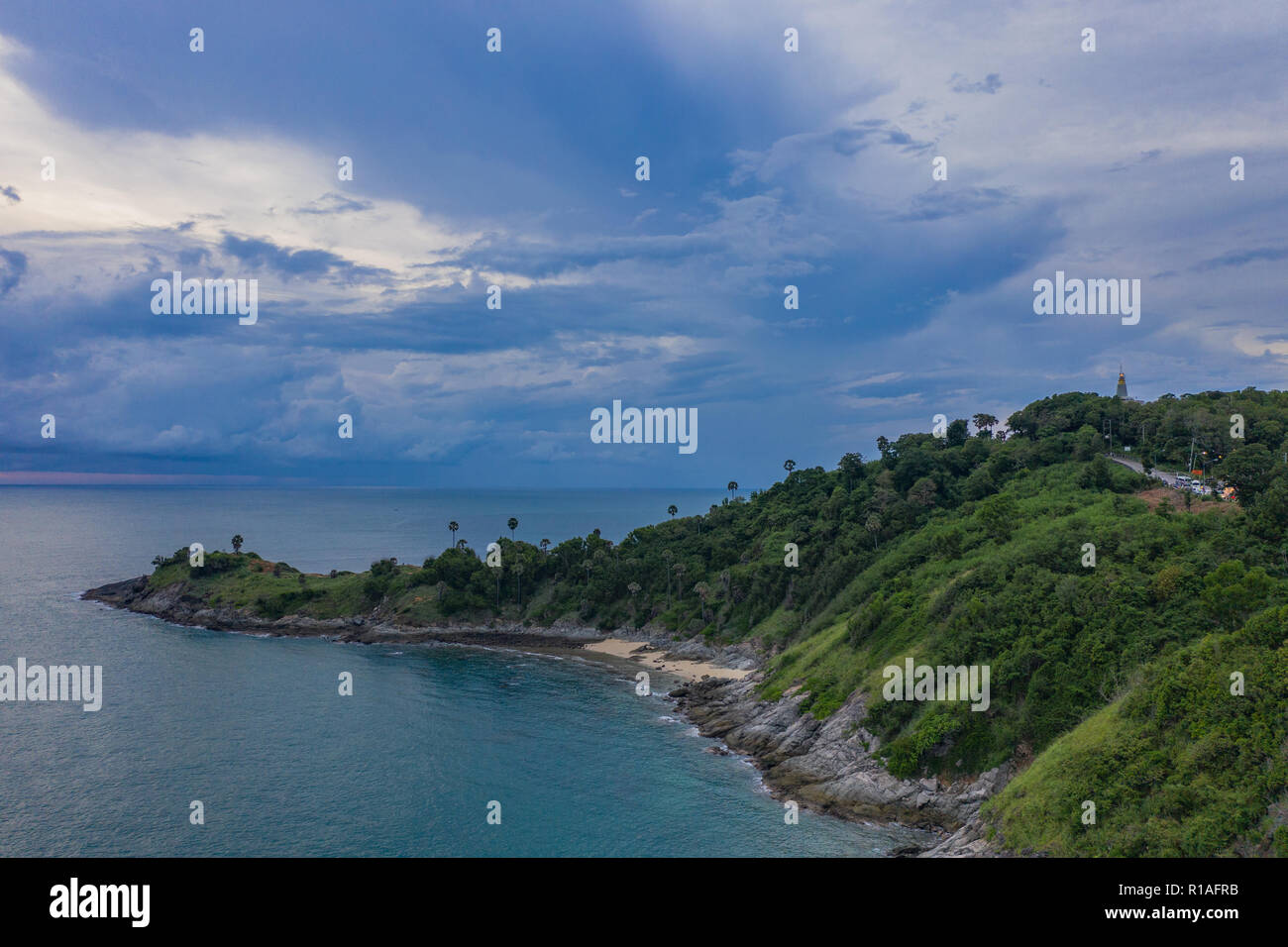 aerial view dark sunset at the rocky outcropping in the sea at Promthep ...