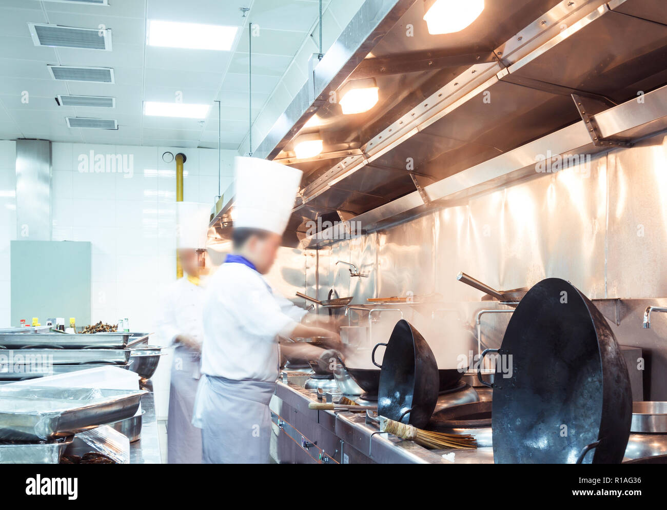 motion chefs of a restaurant kitchen Stock Photo - Alamy