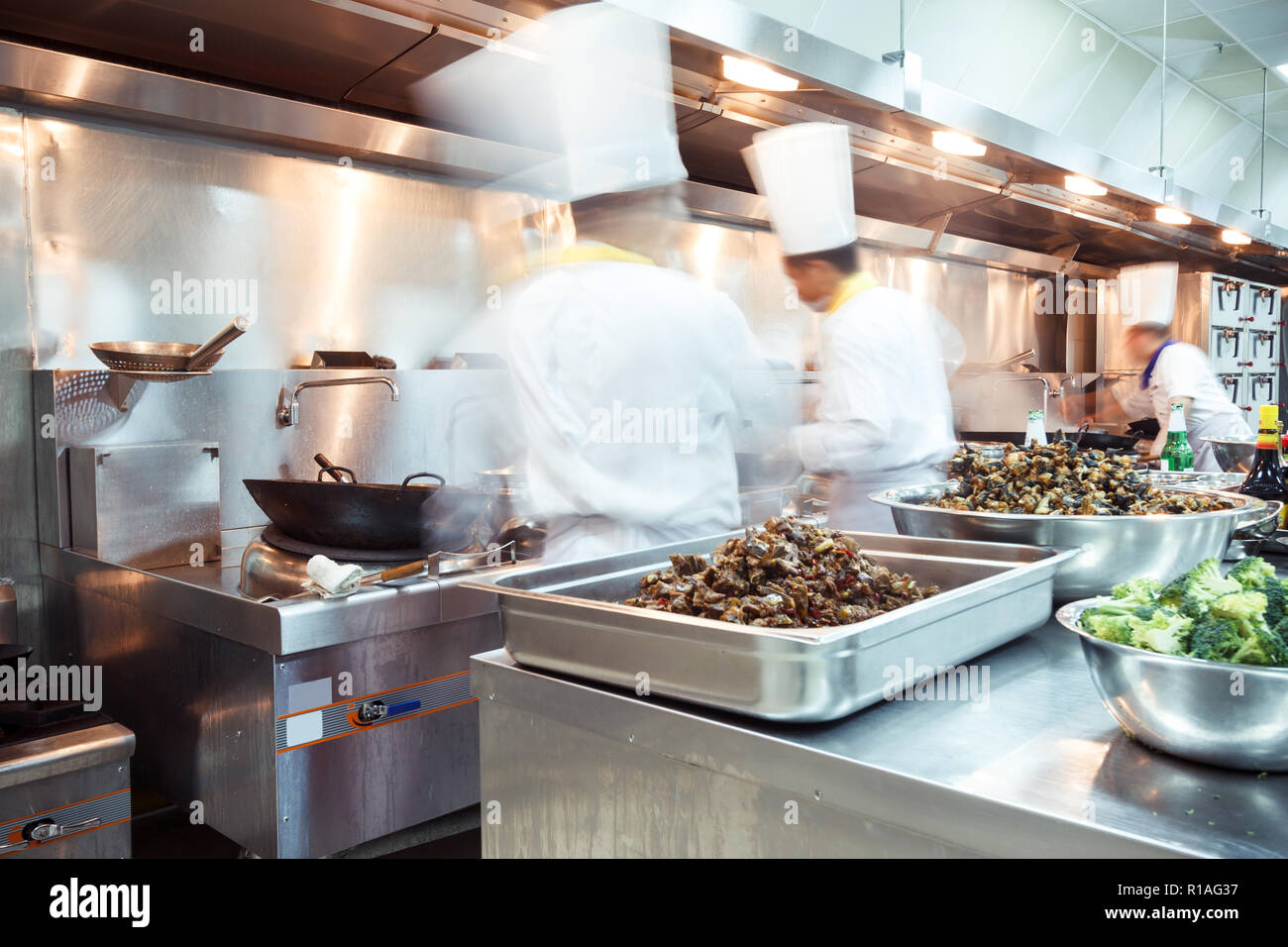 motion chefs of a restaurant kitchen Stock Photo - Alamy