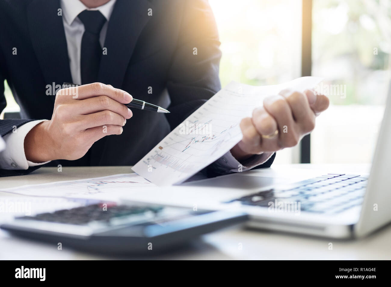 Investor analyzing financial reports hi-res stock photography and ...
