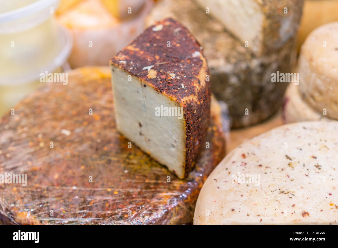 Craft cheese. Cheese head. Artisan cheese Stock Photo - Alamy