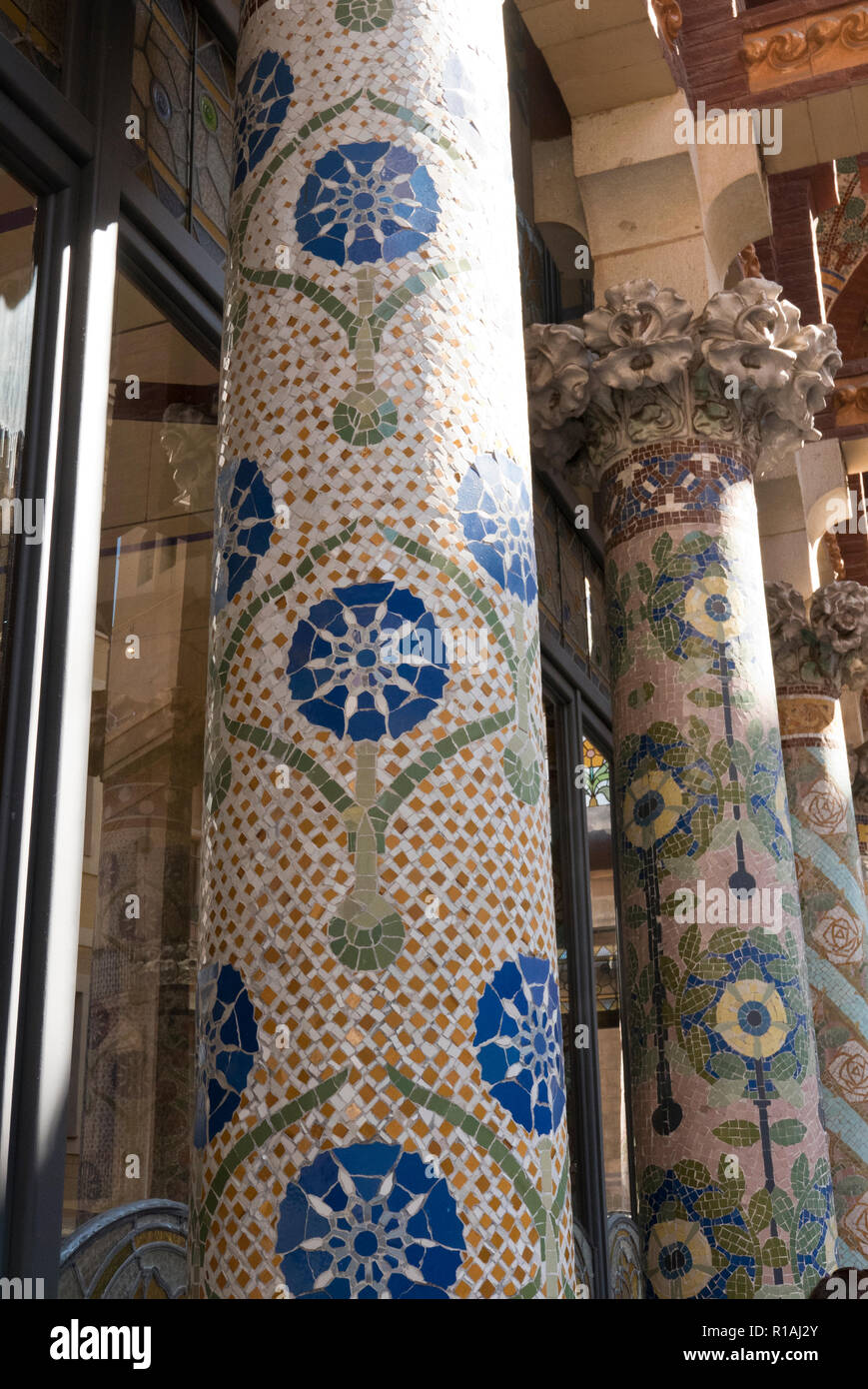 Colourful ornate columns on the exterior balcony of the Palau De La ...
