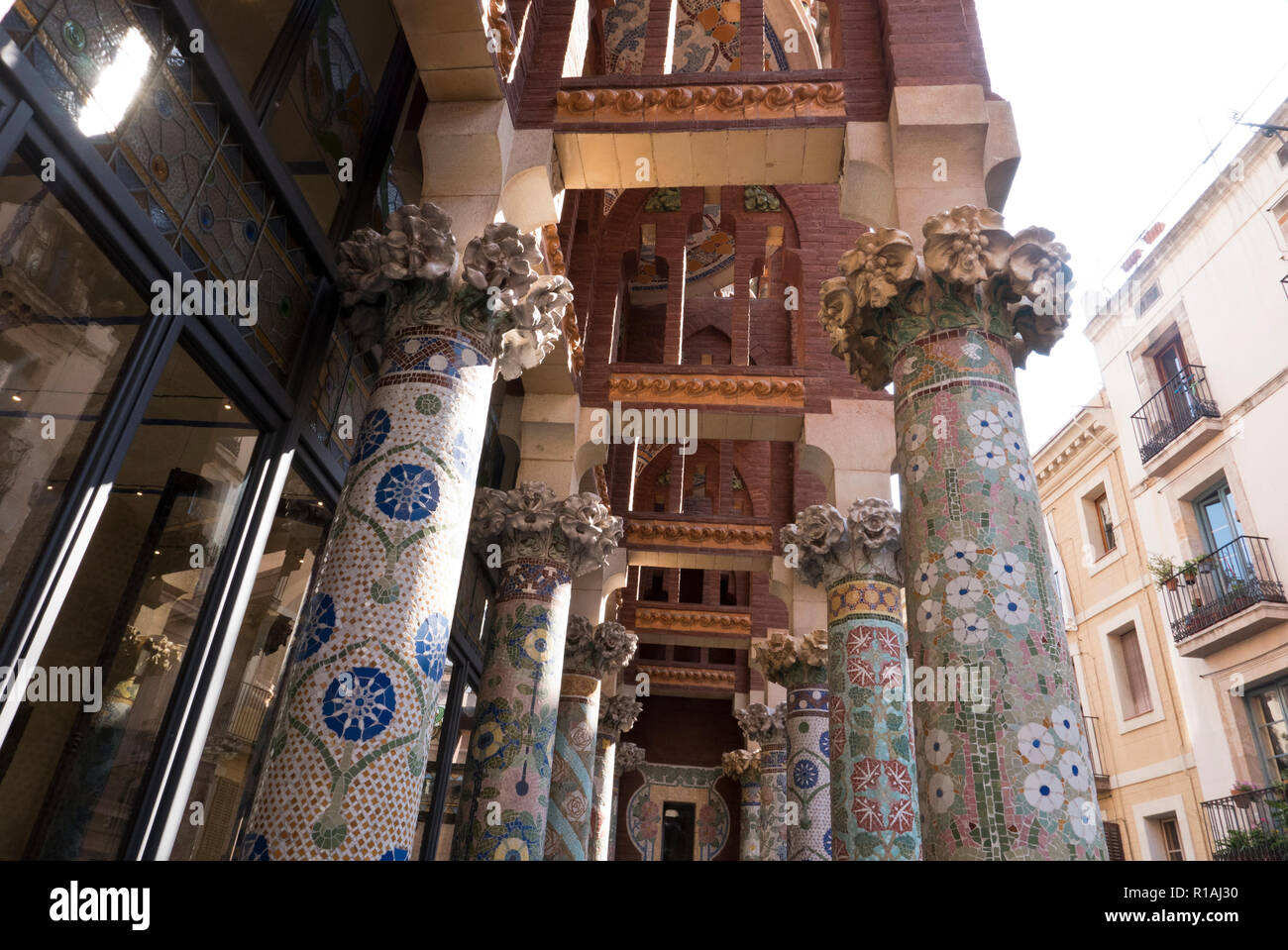 Colourful ornate columns on the exterior balcony of the Palau De La ...