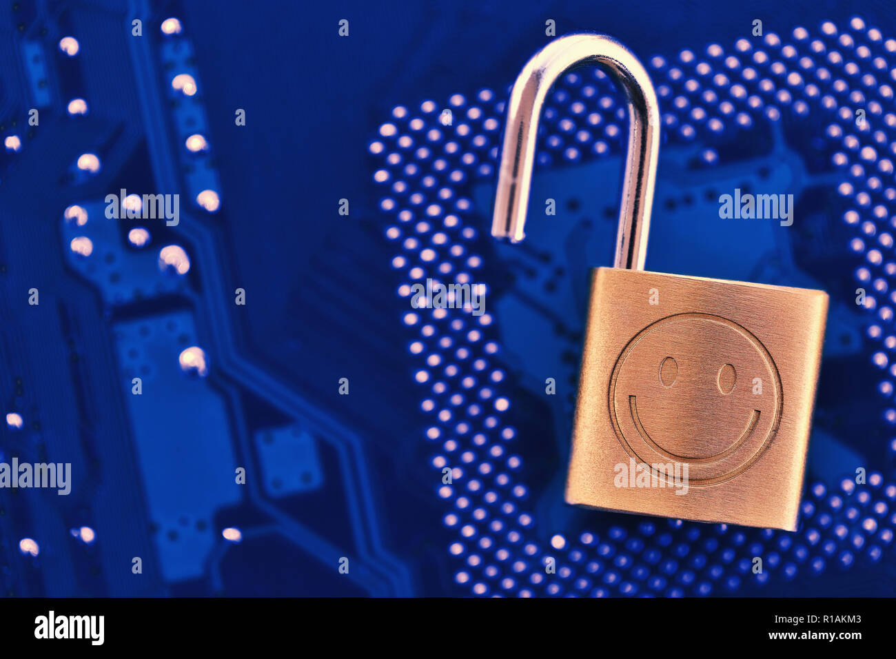 Digital security concept: Open lock on computer chip background with ...