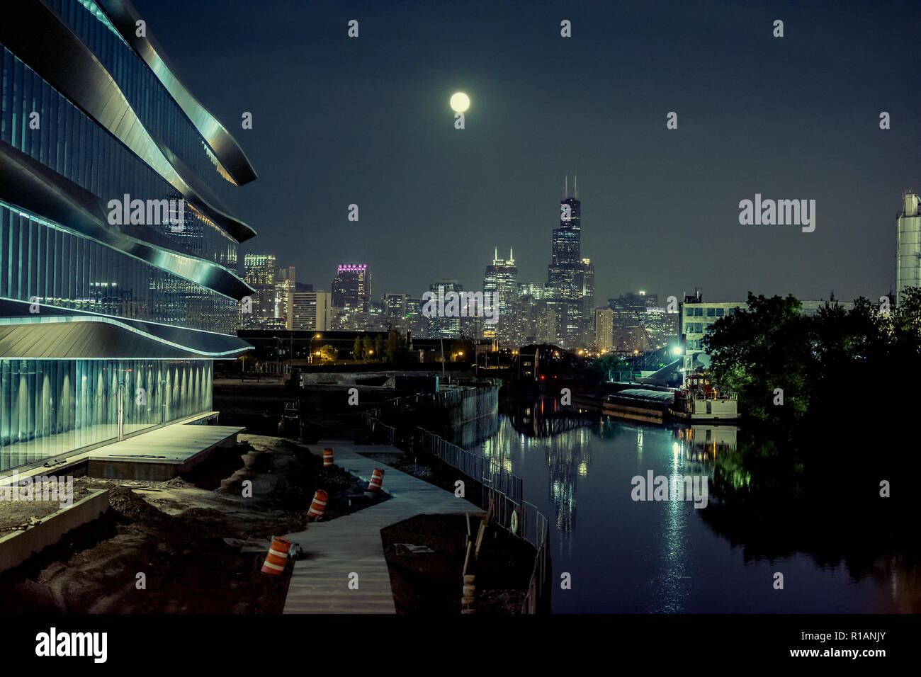 Chicago night skyline with the river and the moon Stock Photo - Alamy