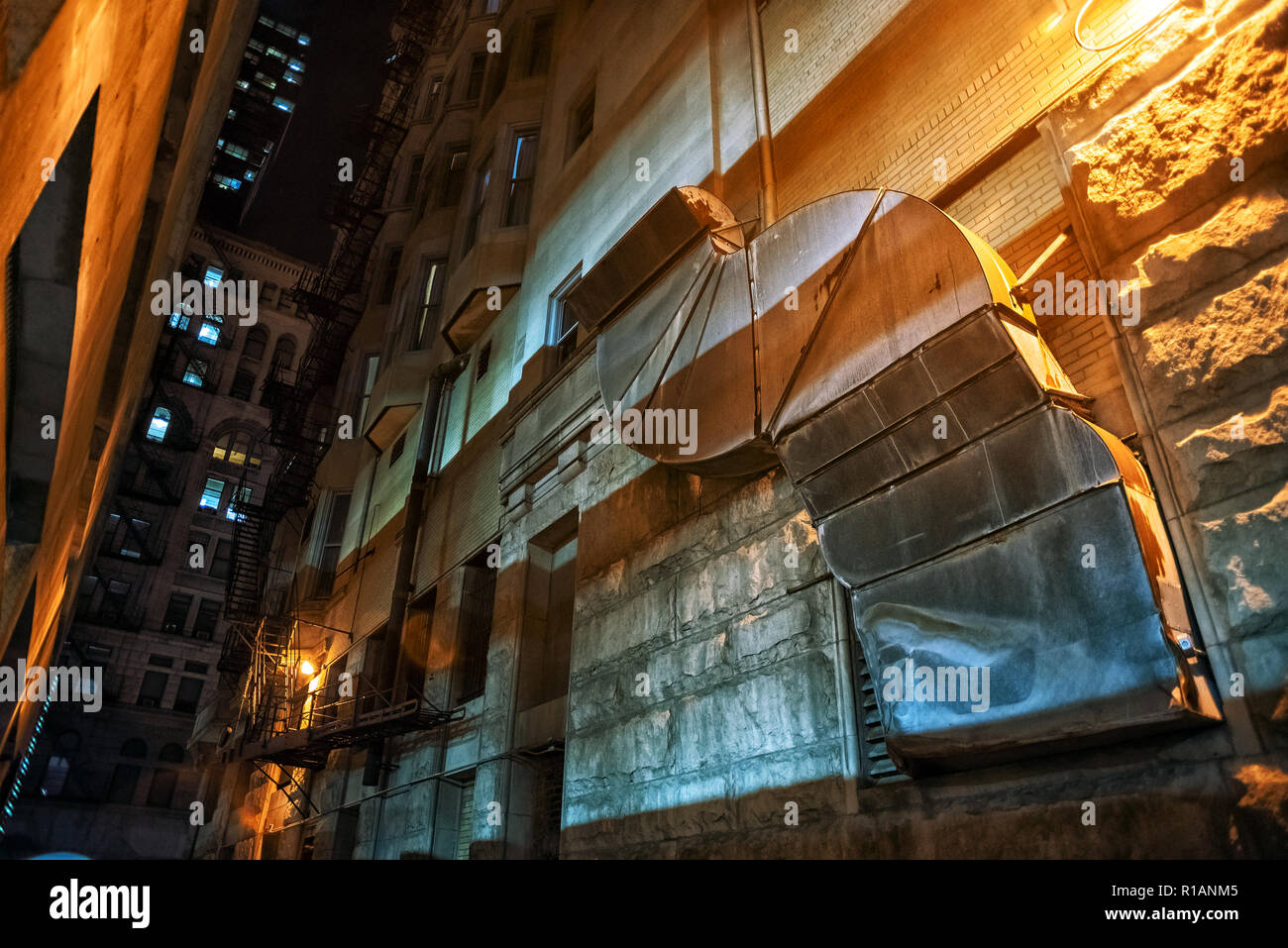 A large big vintage exhaust vent in a dark and scary empty downtown ...