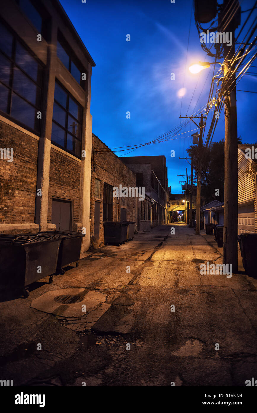 Dark and scary downtown urban city street alley with an eerie vintage ...