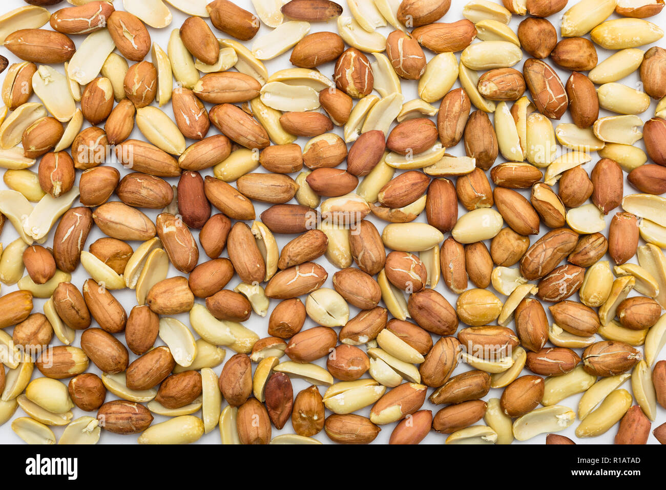 A background of peanuts without shells isolated on a white background ...