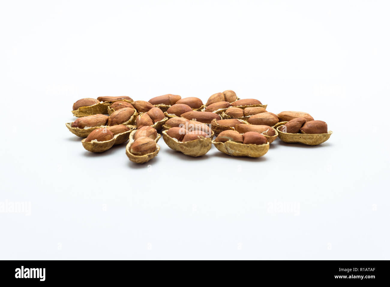 Peanuts in shell isolated on a white background Stock Photo - Alamy