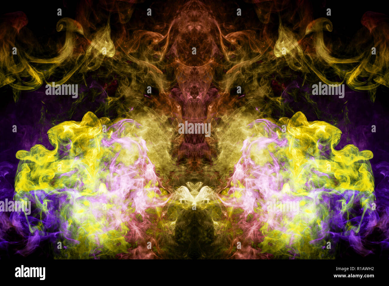 Dense multicolored smoke of pink and yellow colors in the form of a ...