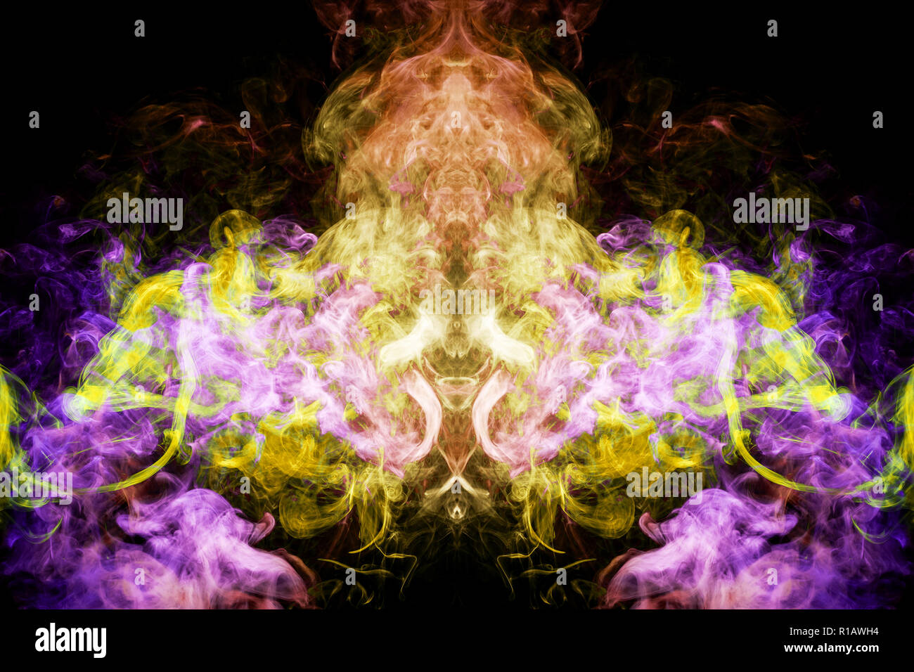 Dense multicolored smoke of pink and yellow colors in the form of a ...