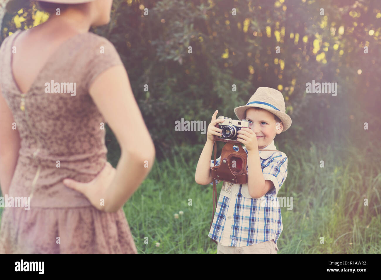 Little girl little boy camera picture hi-res stock photography and ...