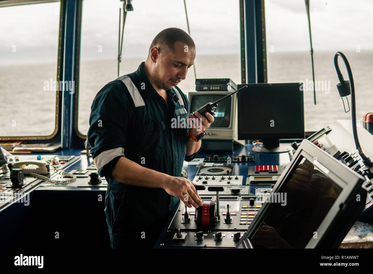 Marine navigational officer is maneuvering ship or vessel Stock Photo ...