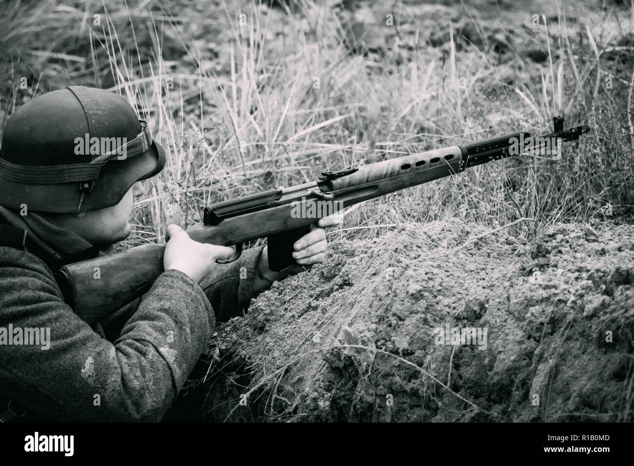 Wehrmacht soldier World War II in a helmet with a rifle in his hands in ...