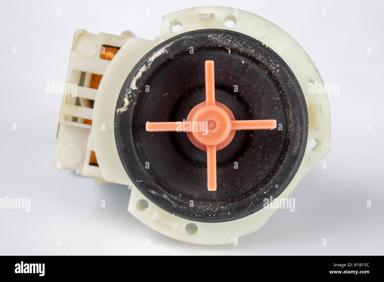 Old washing machine pump. Spare parts for household appliances. Light ...