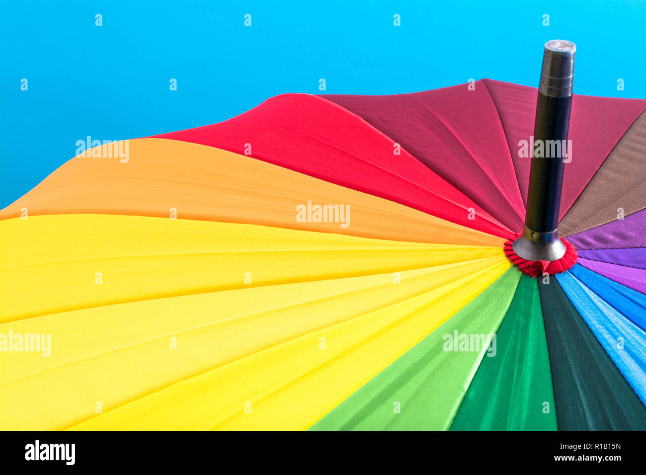 Multi-colored colorful umbrella with all colors of the rainbow with ...