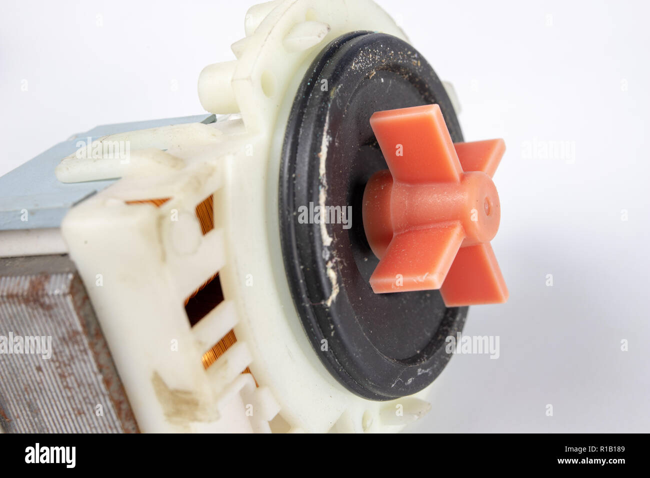 Old washing machine pump. Spare parts for household appliances. Light ...