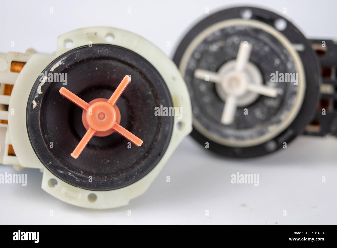 Old washing machine pump. Spare parts for household appliances. Light ...