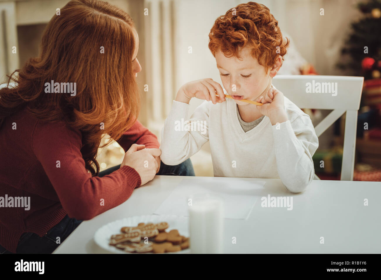 Attentive child listening to his mother Stock Photo - Alamy