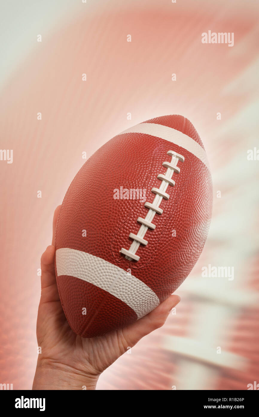 Football and hand hi-res stock photography and images - Alamy