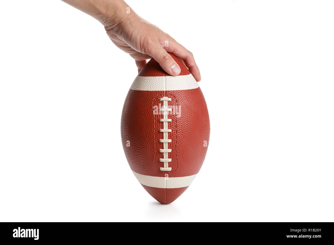 Hand american football hi-res stock photography and images - Alamy