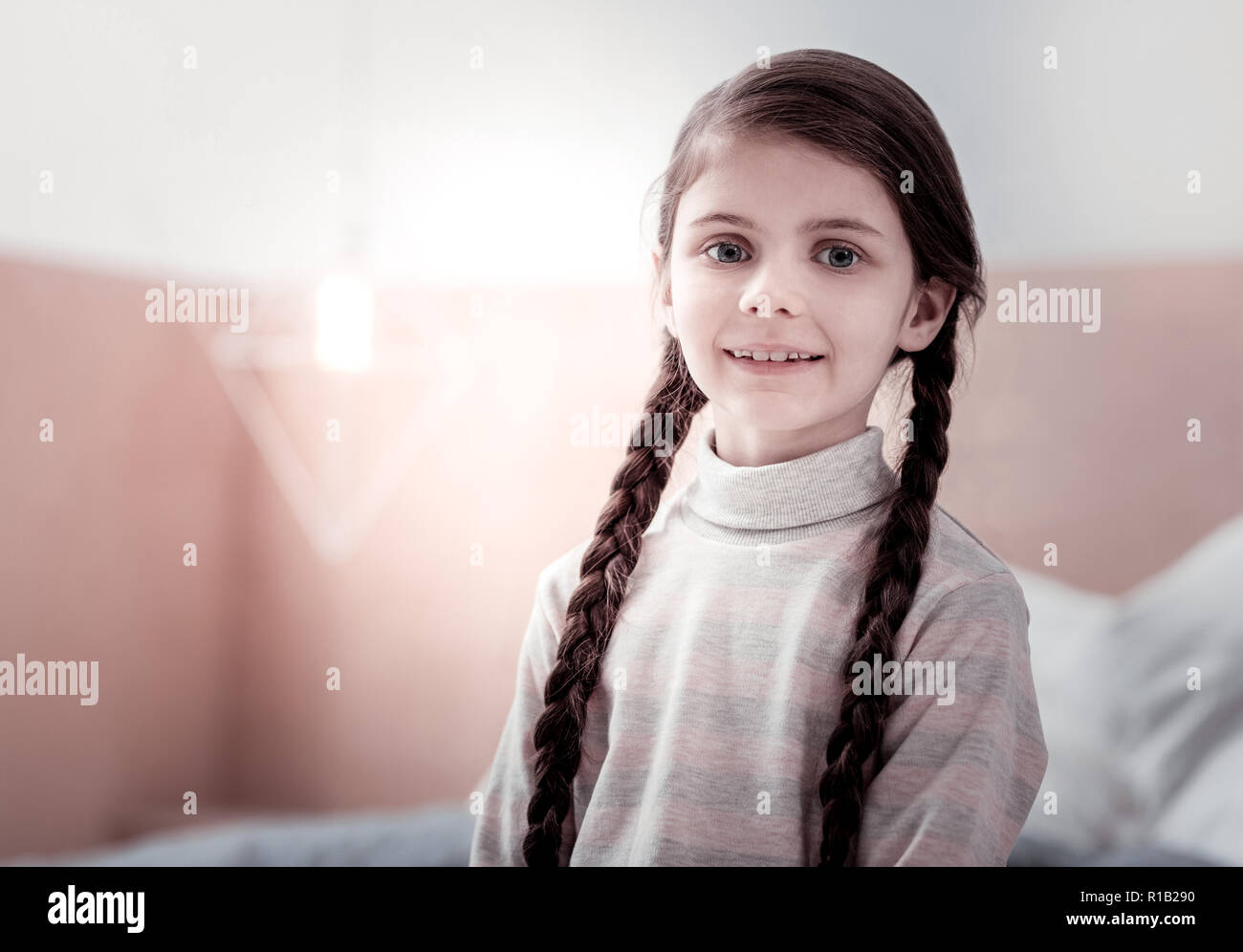 Portrait of amazing child with braids Stock Photo - Alamy