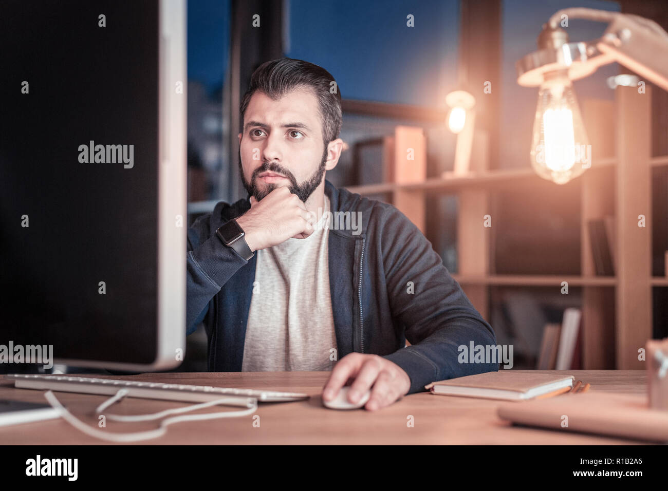 Serious male person working in the office Stock Photo - Alamy
