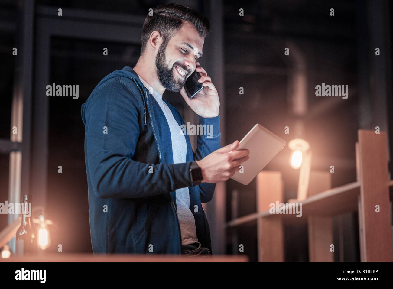 Cheerful programmer having video conversation Stock Photo - Alamy Cheerful programmer having video conversation Stock Photo - Alamy