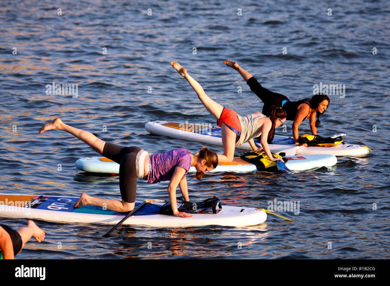 Paddleboard yoga class on the Hudson river in New York City Stock Photo ...