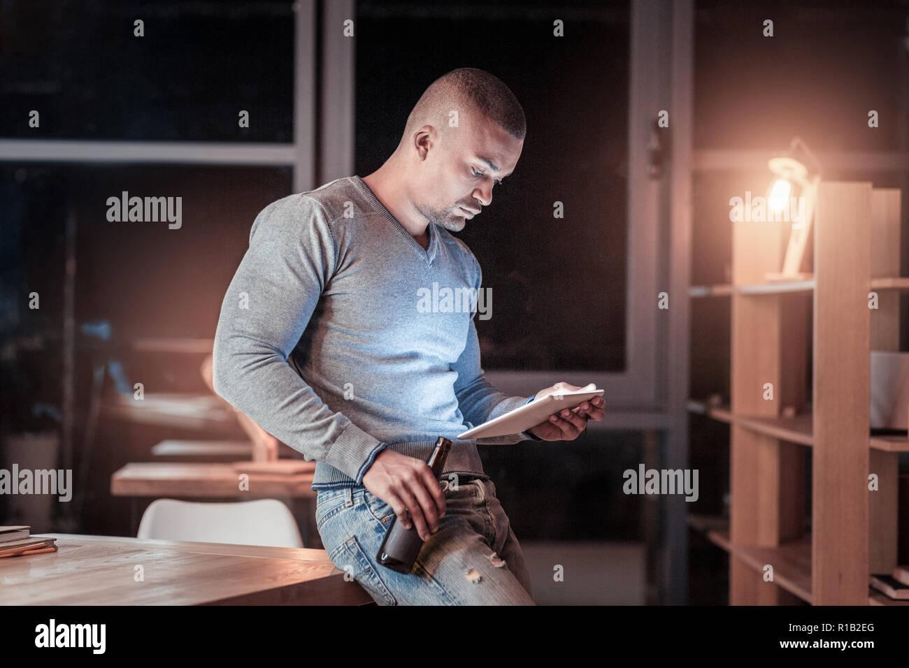 Attentive male person checking mail Stock Photo - Alamy