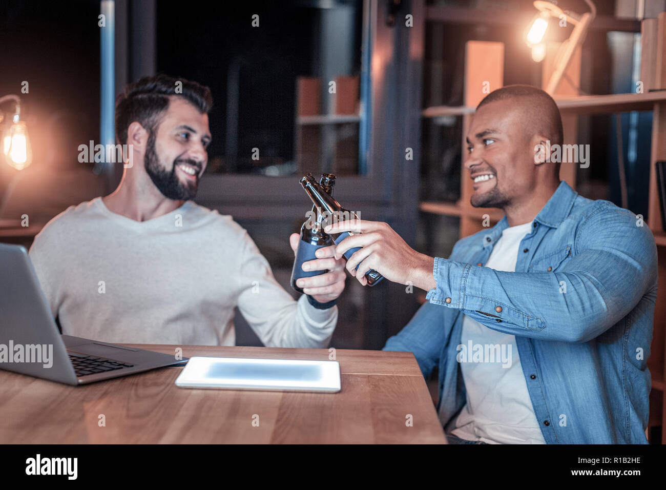 Relaxed colleagues having party after work Stock Photo - Alamy
