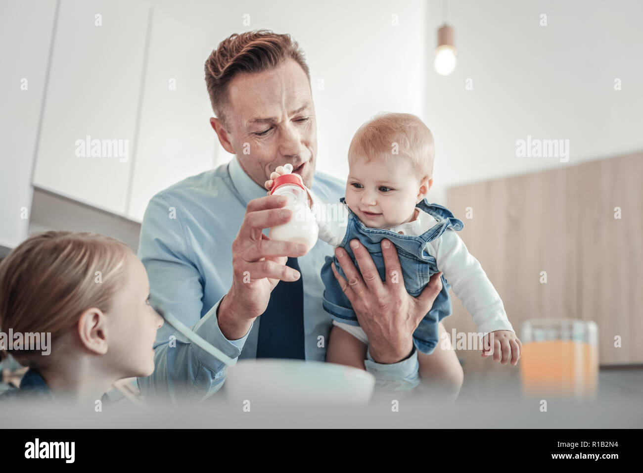 Parent supporting child hi-res stock photography and images - Alamy