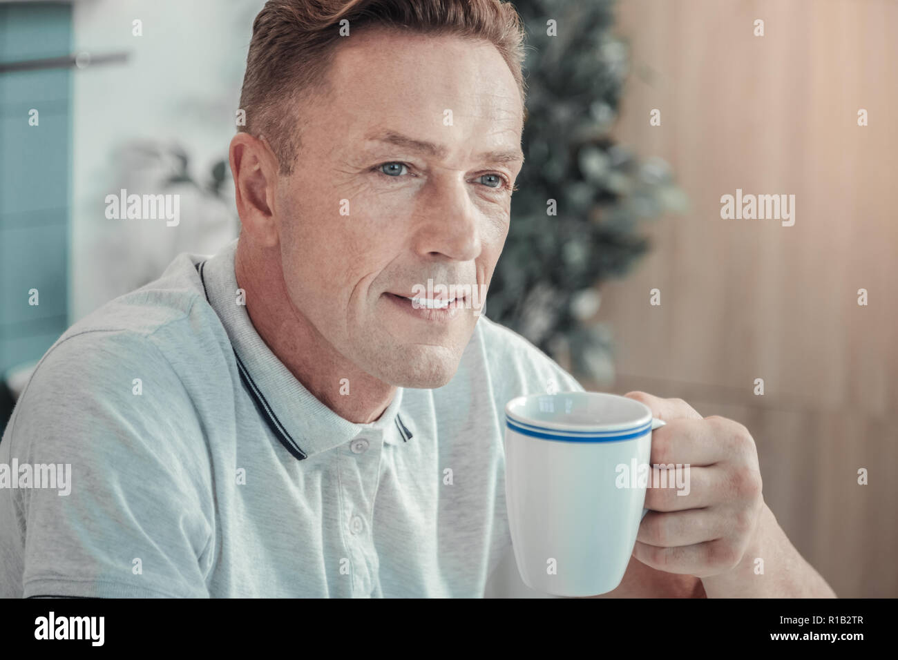 Handsome man drinking tea hi-res stock photography and images - Alamy