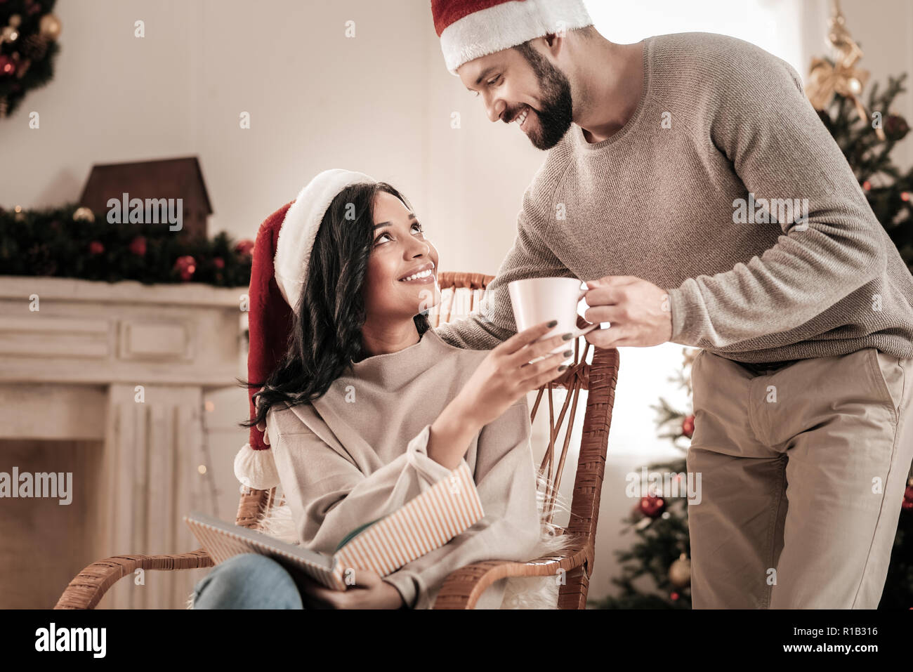 Relaxed brunette sitting in rocking-chair Stock Photo - Alamy