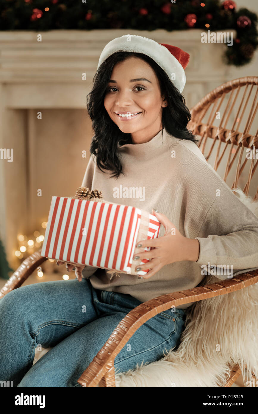 Woman holding a gift hi-res stock photography and images - Alamy