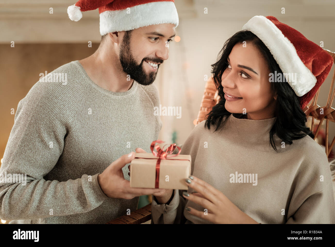 Nice young woman getting a gift Stock Photo - Alamy