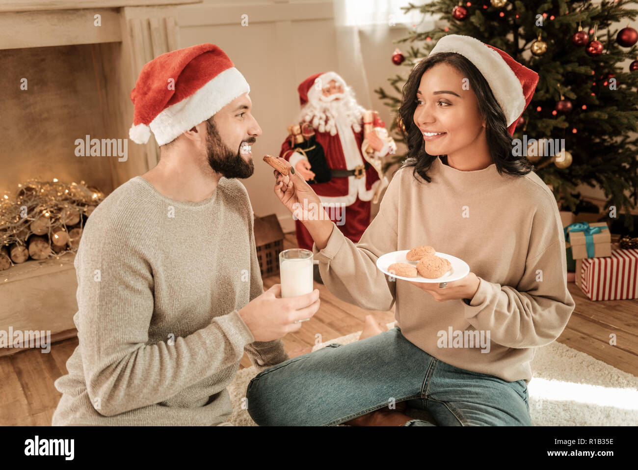 Romantic young woman feeding boyfriend hi-res stock photography and ...