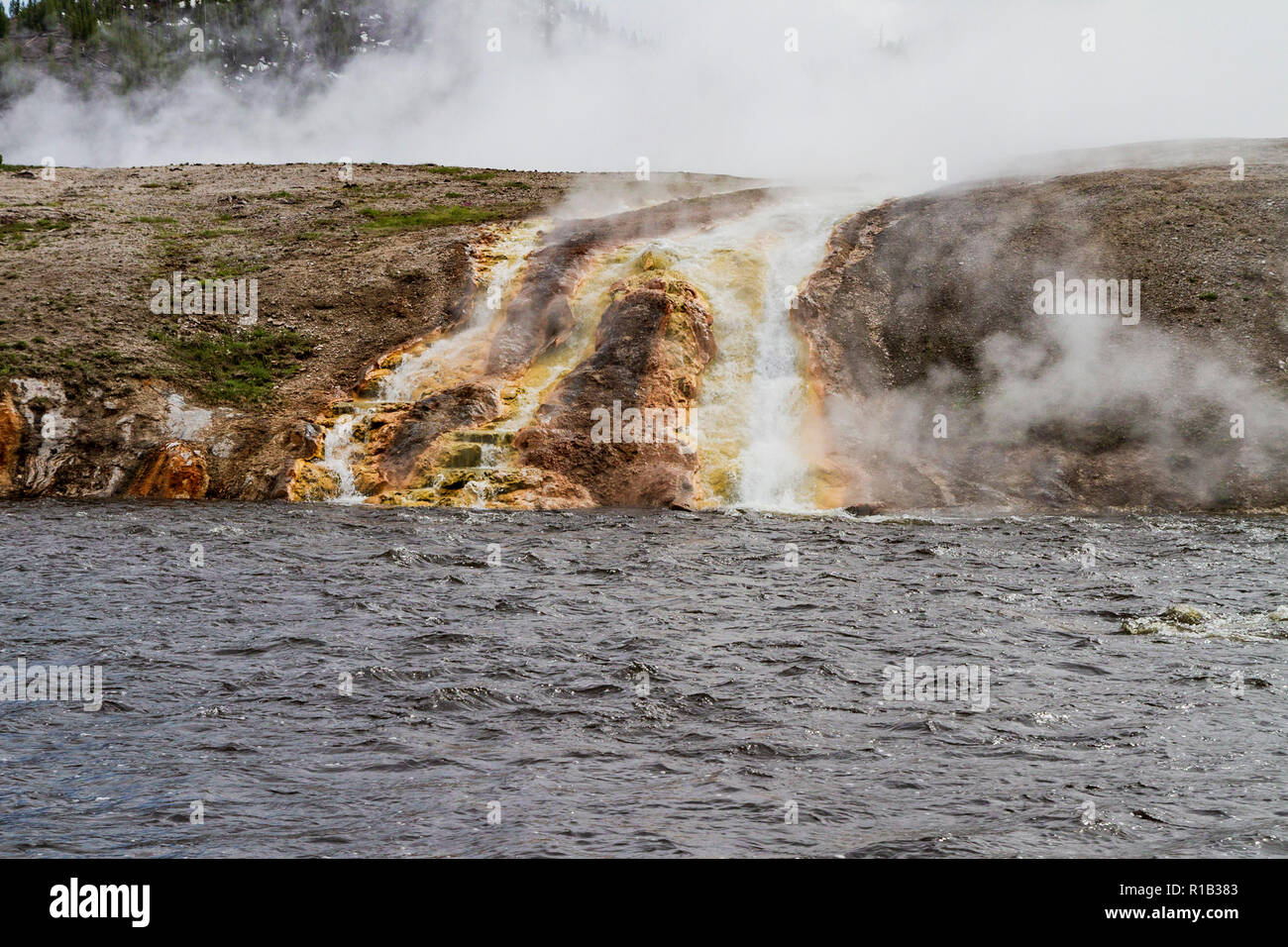 Hotspring water falling into the river in Yellowstone Stock Photo - Alamy