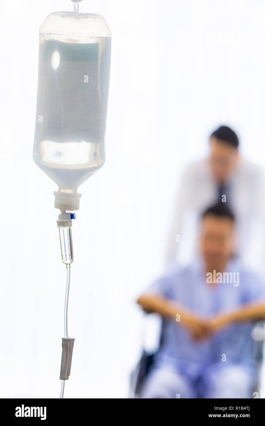 Set iv fluid intravenous drop saline drip in hospital room with patient ...