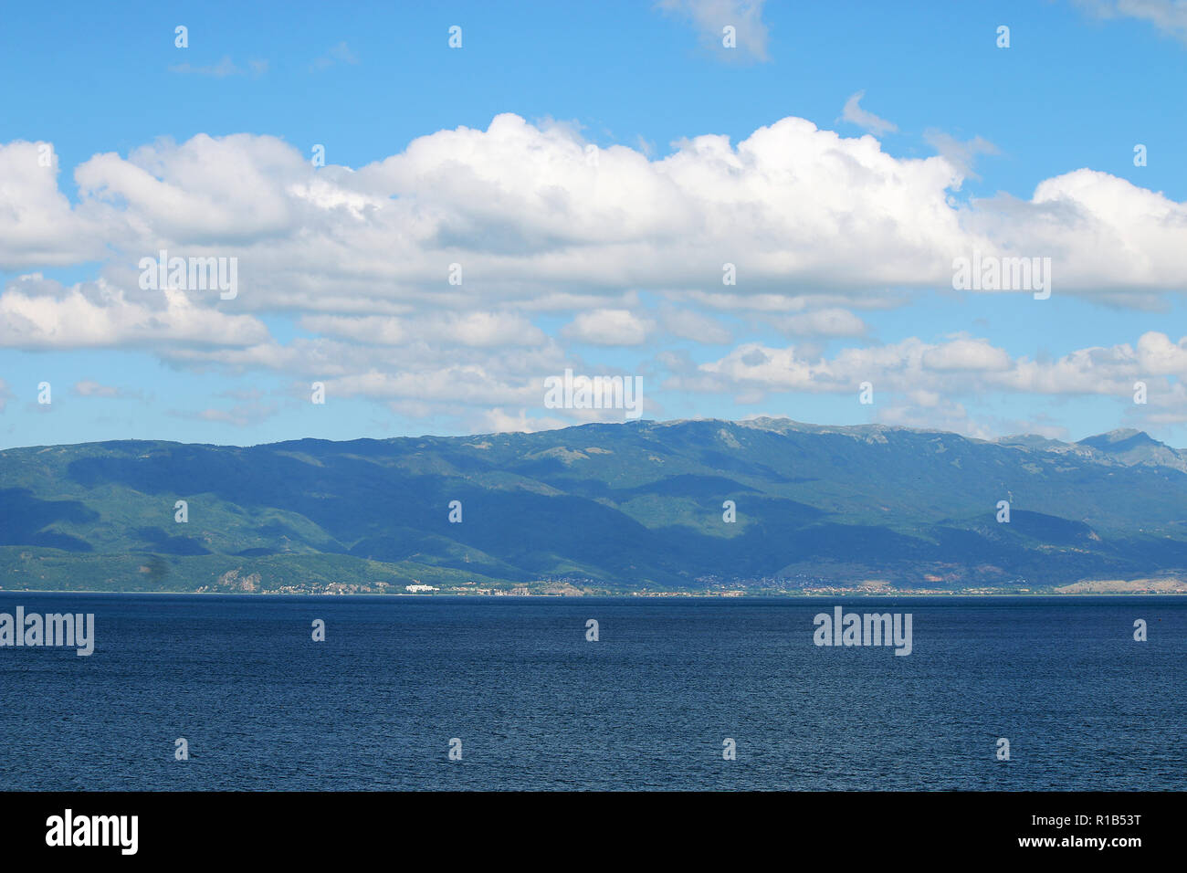 blue water mountains and sky with clouds Lake Ohrid landscape Macedonia ...