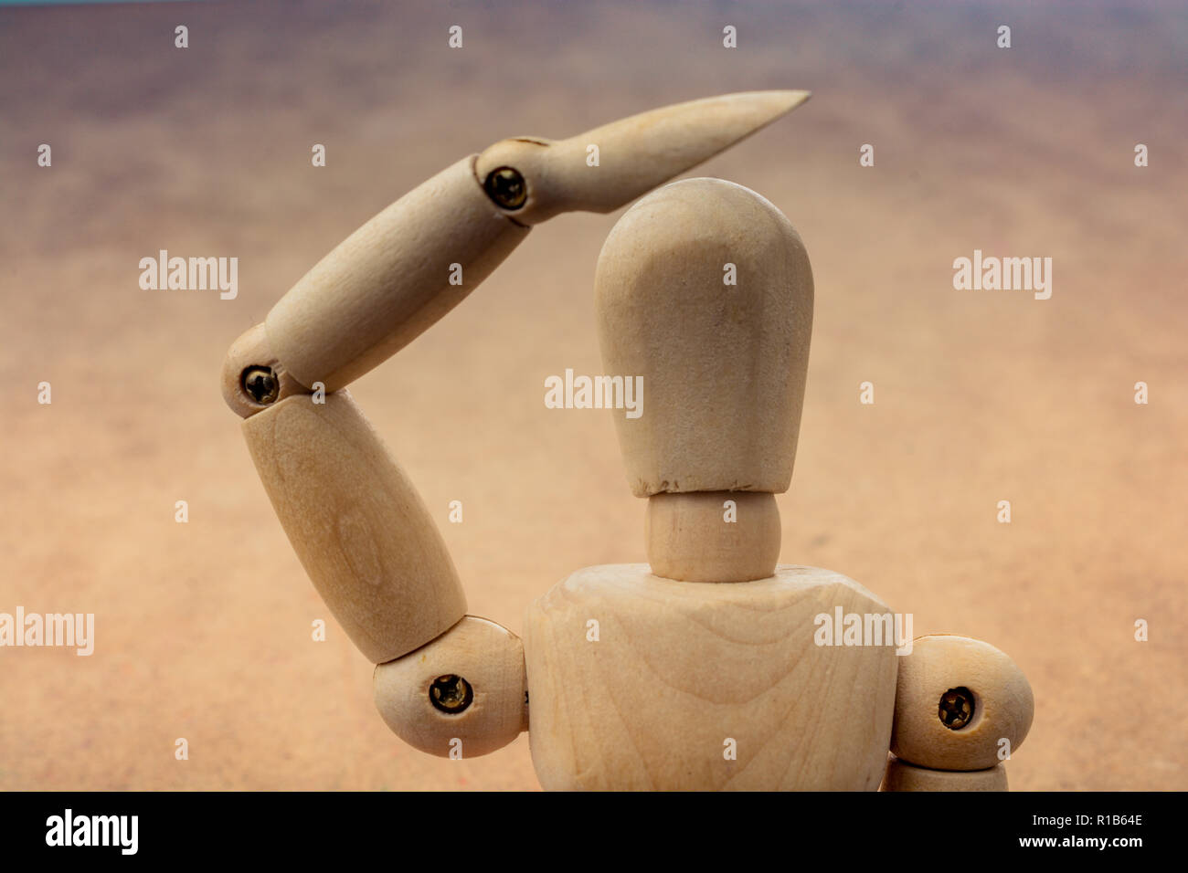 Anatomy doll making a hand gesture on a wooden background Stock Photo ...