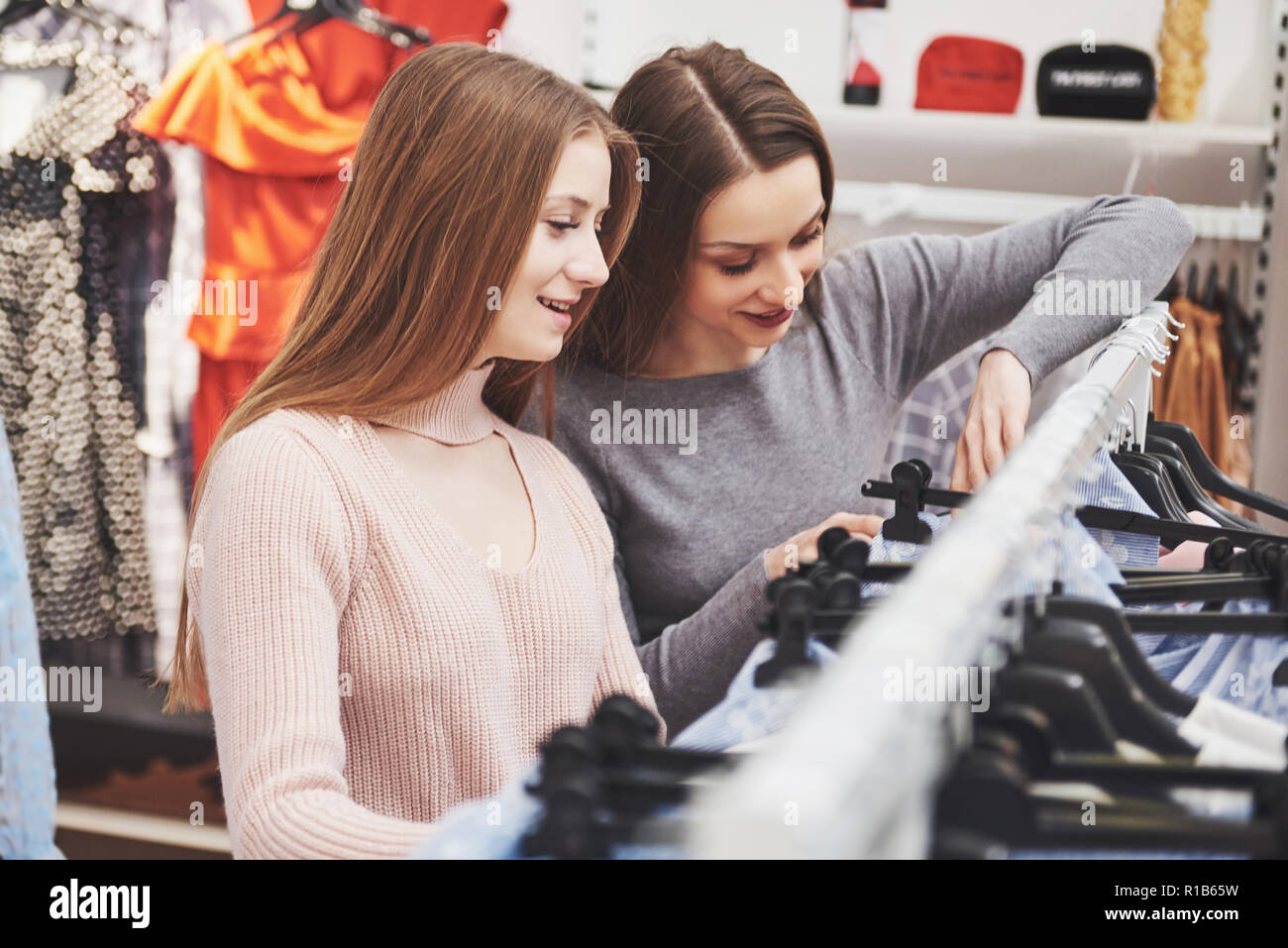 Young beautiful women at the weekly cloth market - Best friends sharing ...