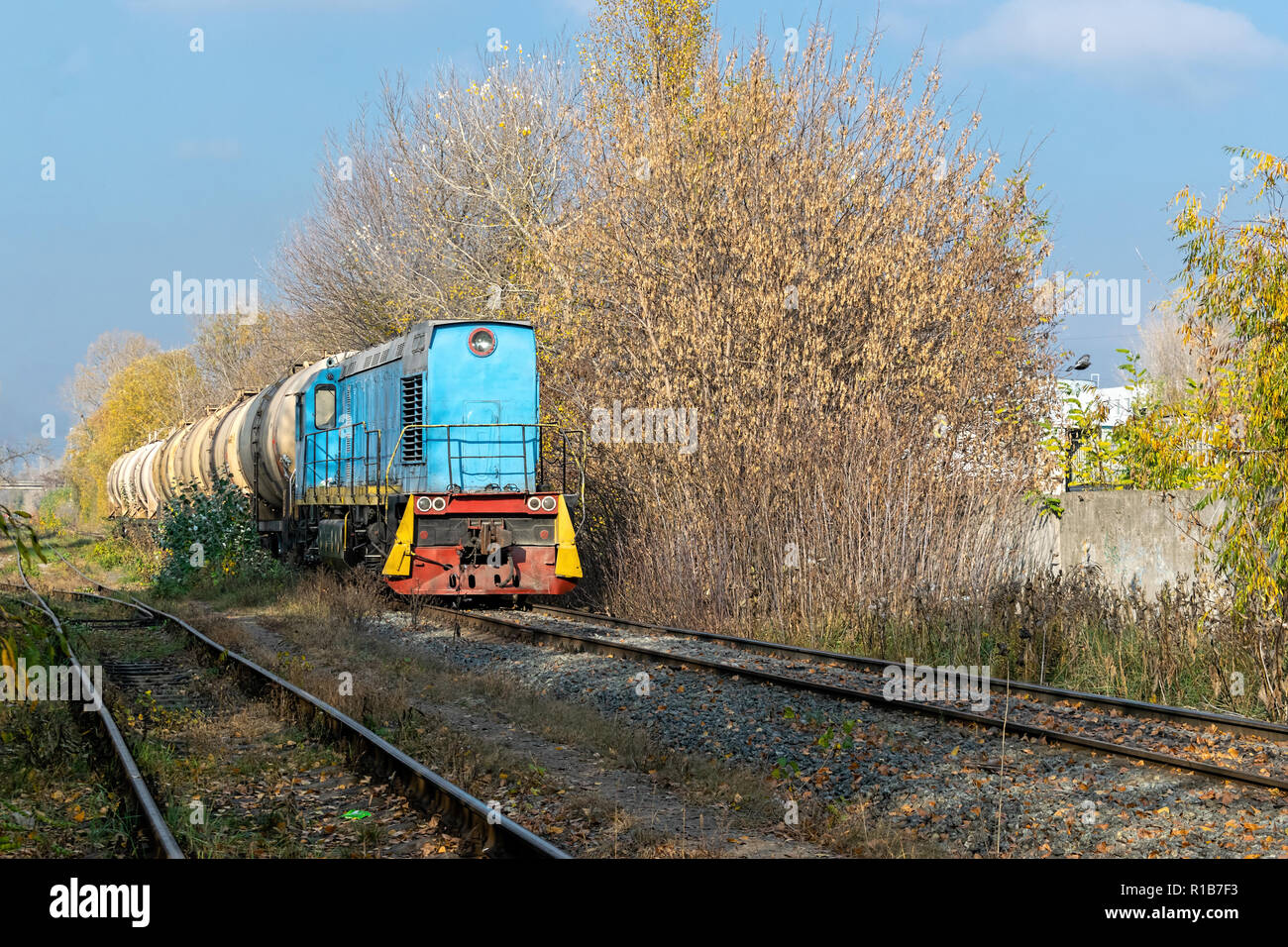 Diesel locomotive delivering oil in tanks in the industrial area Stock ...